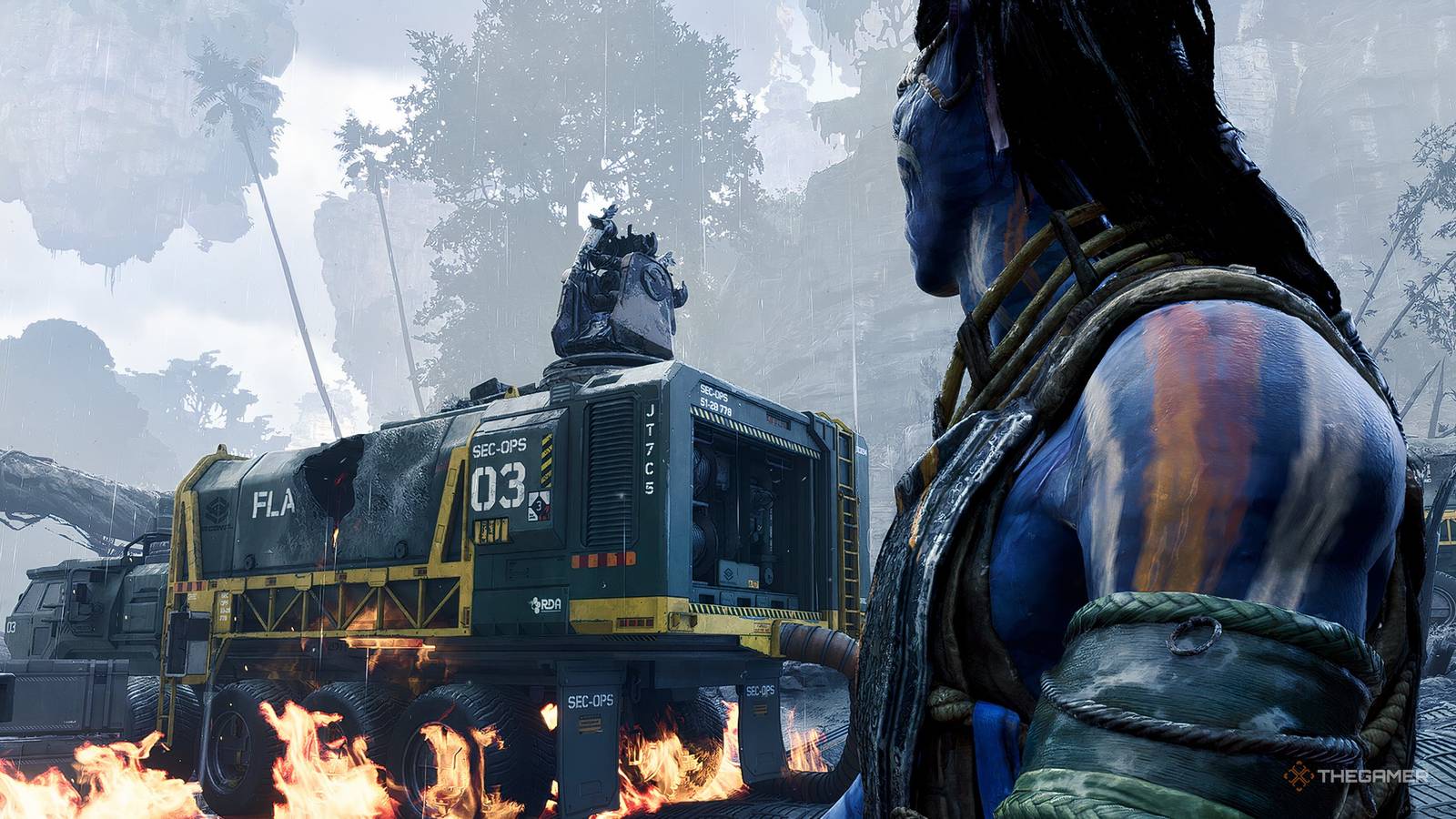 Avatar Frontiers Of Pandora So'lek watching a fuel truck burn in the rain.